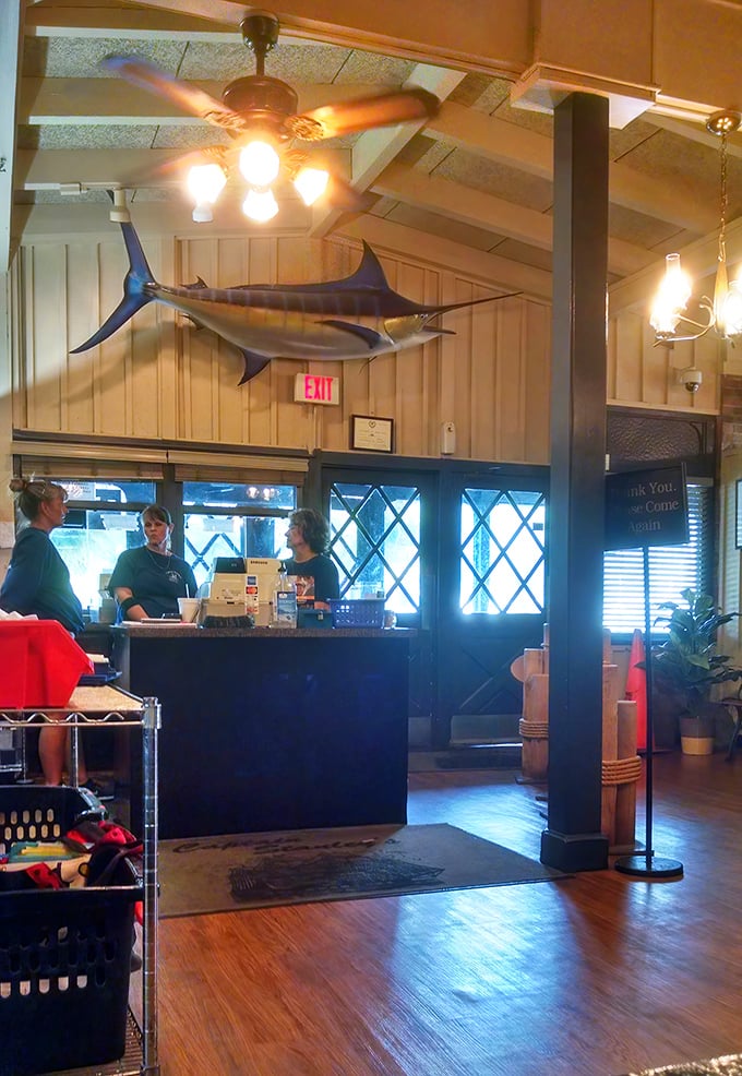 The host station crowned with a magnificent marlin – because nothing says "we take seafood seriously" quite like a trophy fish.