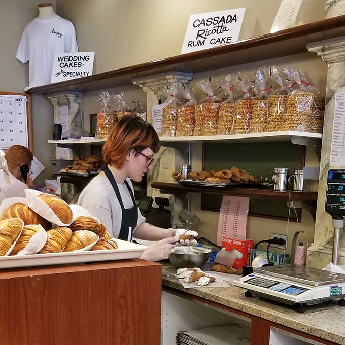 Behind every perfect pastry is a skilled artisan with flour-dusted hands. This isn't mass production—it's edible craftsmanship happening before your eyes.