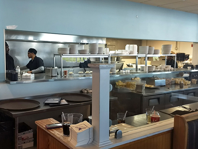 Behind the scenes, culinary magic happens with practiced precision – turning fresh catches into plates of pure joy.