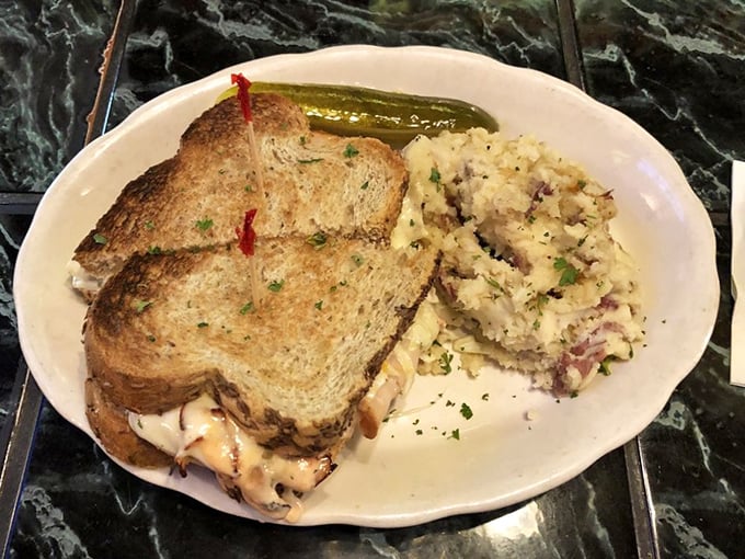 This isn't just lunch; it's a proper meal—hearty sandwich meets potato salad in a partnership more satisfying than most marriages.