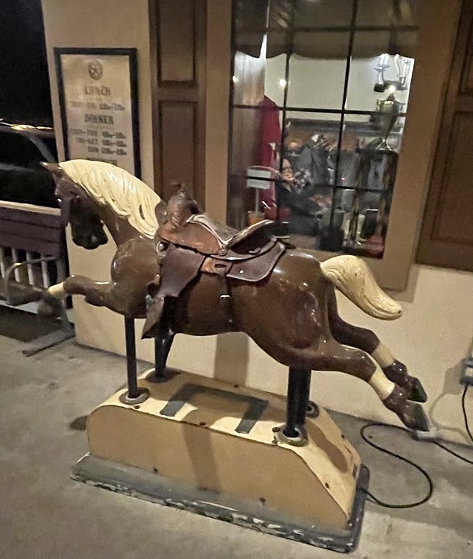 The vintage coin-operated horse—because every great meal should start with a little whimsy. Saddle up before you settle in.