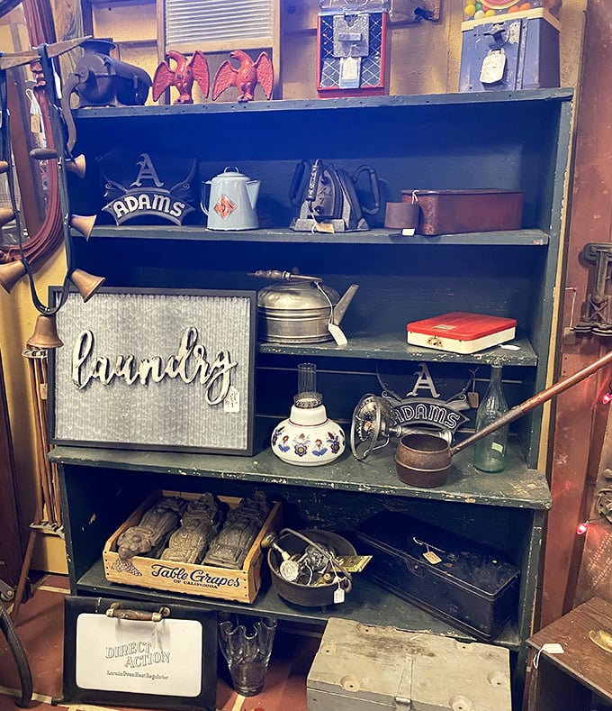 This isn't just a shelf of vintage housewares—it's a museum of American domestic life where every enamel pot and tin sign tells a story.
