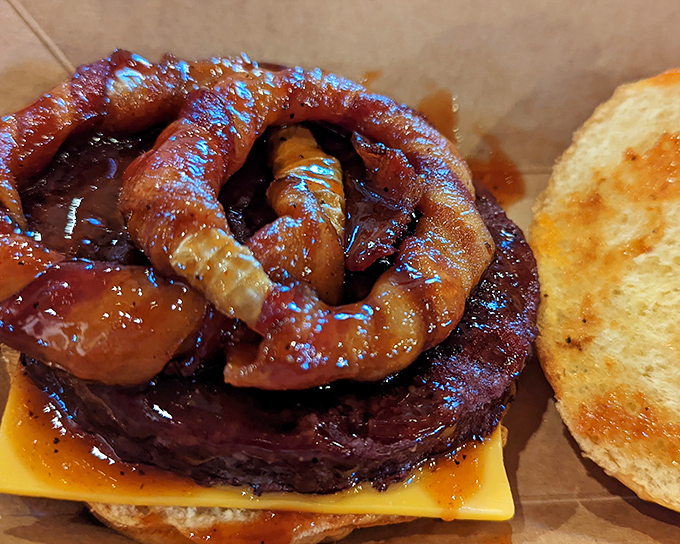 This isn't just a burger—it's a meaty masterpiece topped with sausage that makes ordinary cheeseburgers look like they're not even trying.