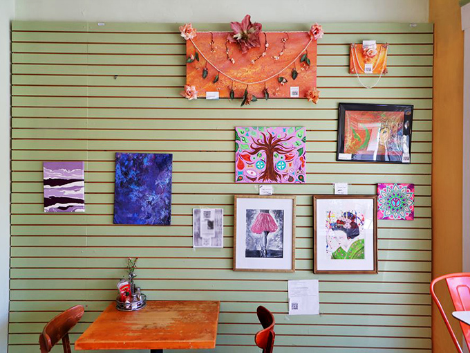 Local artwork transforms a simple wall into a gallery of expression, proving that feeding your eyes can be just as important as feeding your stomach.