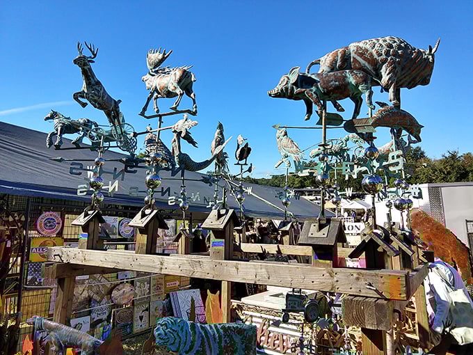 Metal menagerie against the sky—weathervanes and sculptures capturing wildlife in copper and steel, ready to crown someone's garden shed.