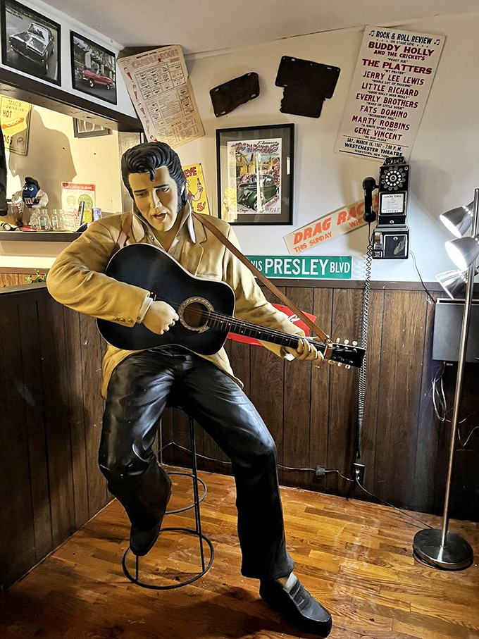 Elvis hasn't left the building—he's permanently stationed at Mac's, eternally serenading diners with silent rockabilly charm.