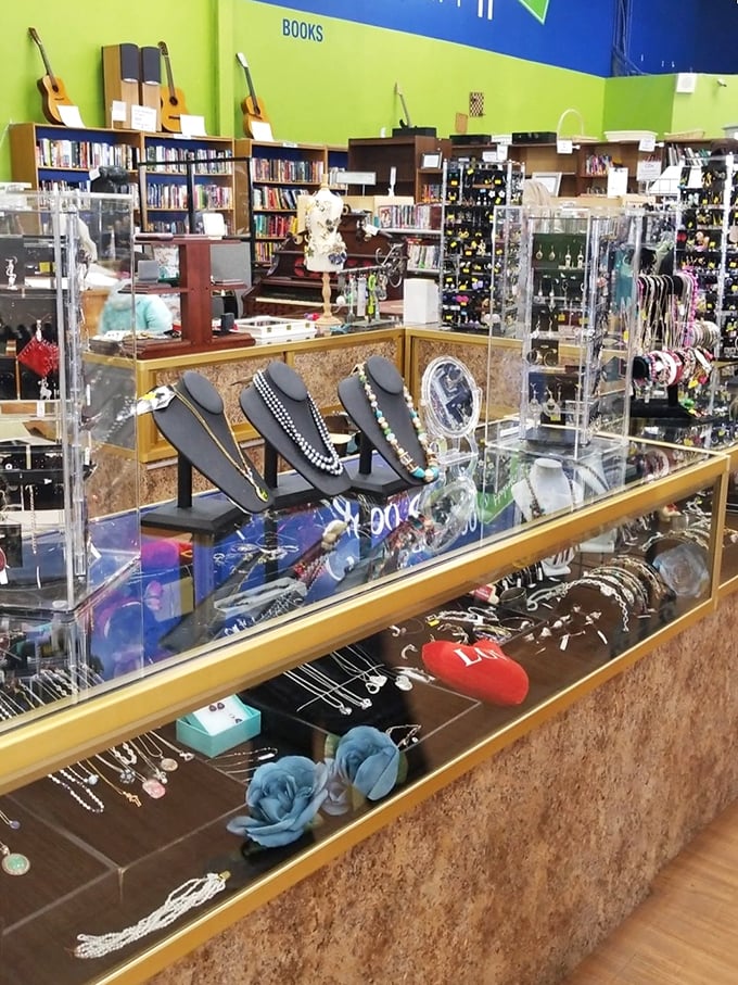 Jewelry displays that whisper, "One person's abandoned accessory is another's statement piece," while books lurk temptingly in the background.