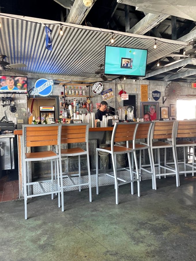 The bar at Crabby Bill's isn't just serving drinks—it's dispensing liquid Florida sunshine and stories from locals who know where the fish are biting.