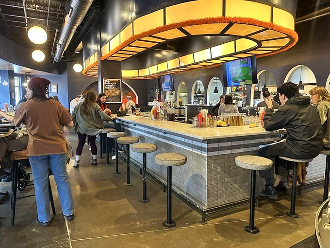 The counter where breakfast dreams come true, illuminated by lighting fixtures that look like they were borrowed from the Jetsons' dining room.
