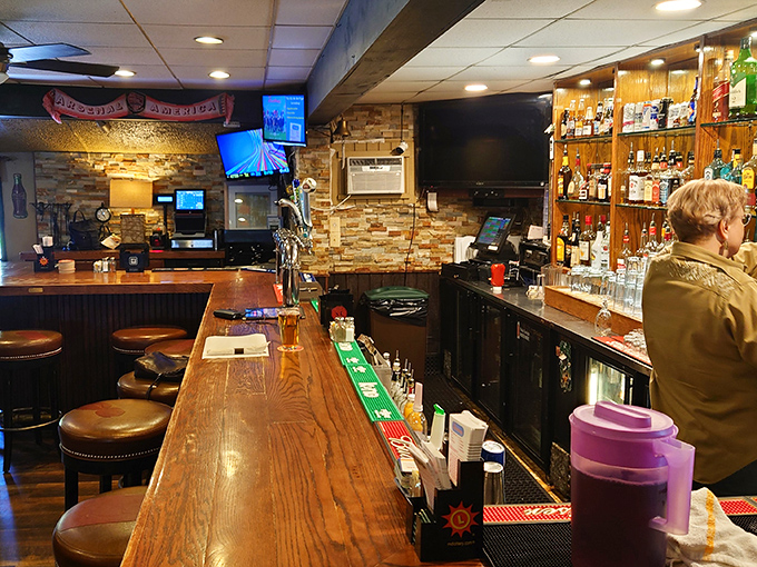 The bar area – where strangers become friends over stories and spirits. That wooden bartop has heard more Maryland tales than a history professor.