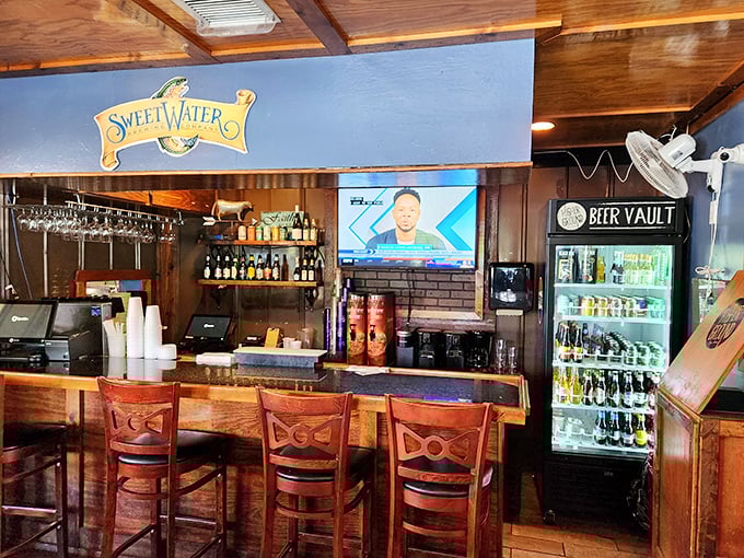 The bar area isn't an afterthought – it's a destination. Local craft beers, Sweetwater on tap, and a TV perfectly positioned for casual viewing.