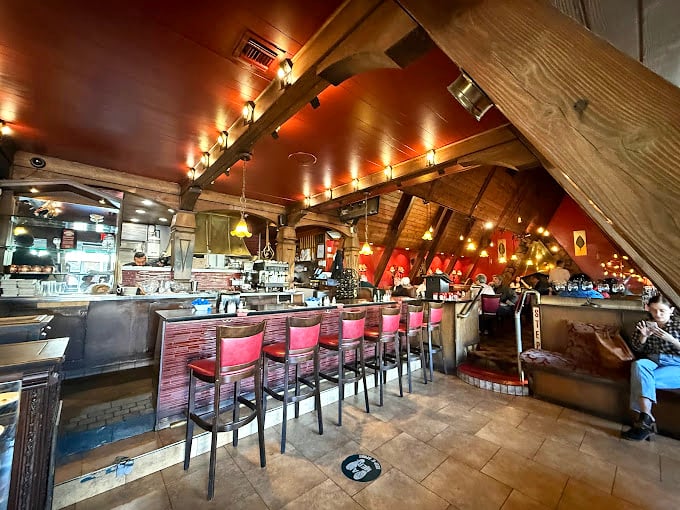Even the bar area maintains that cozy cabin feel that makes every meal feel special.