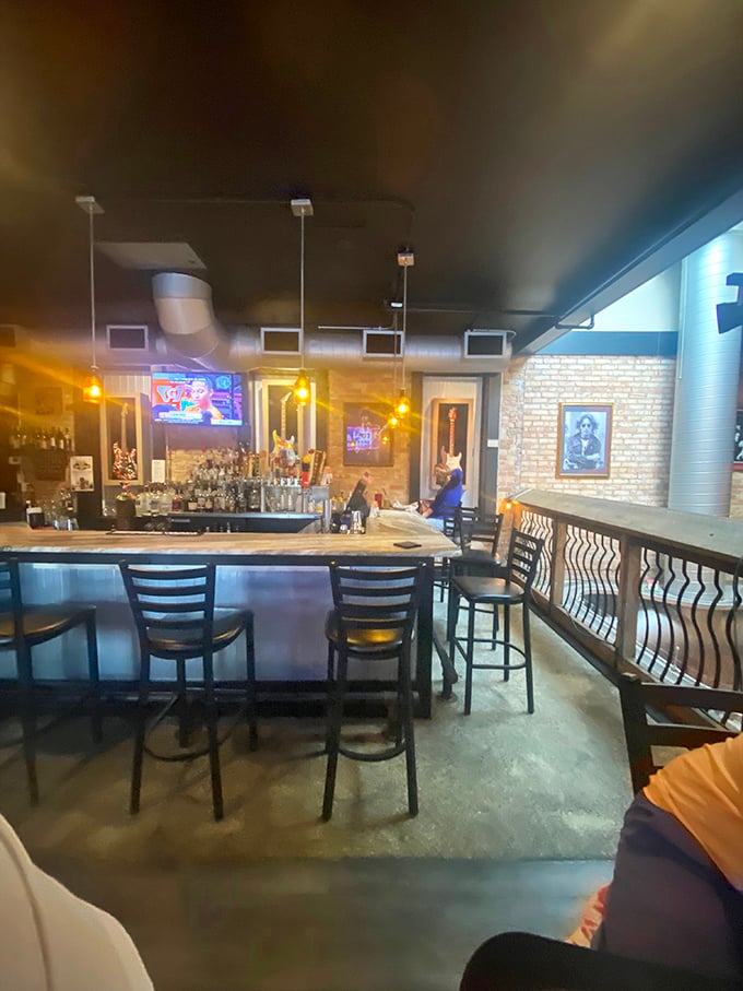The bar area—where strangers become friends and friends become burger evangelists under the warm glow of pendant lights.