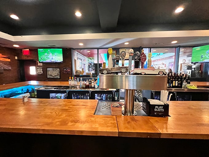 The bar area where strangers become friends over chicken stories and cold drinks – like Cheers, but with better food and Route 66 memorabilia.
