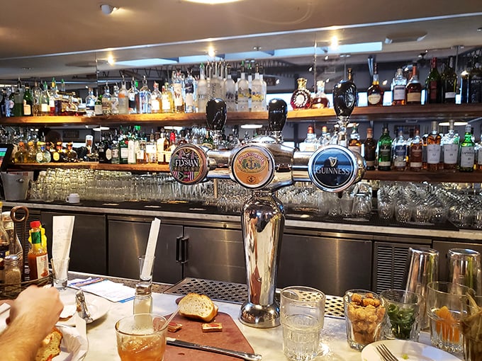 The bar at Sam's isn't just well-stocked—it's a front-row seat to coastal mixology with ocean views on the side.