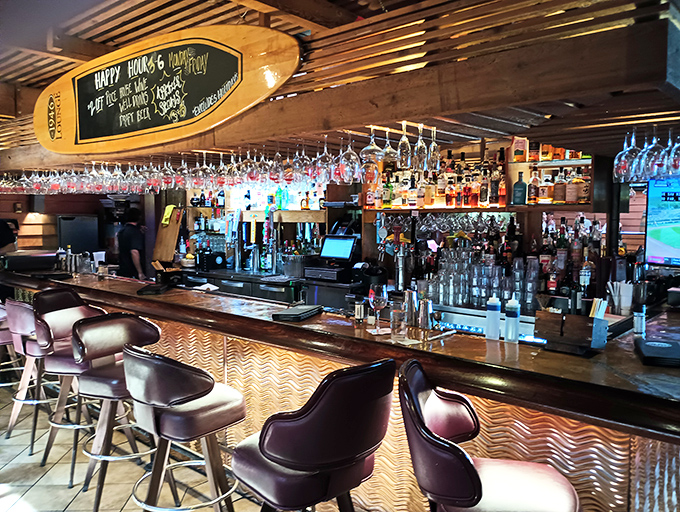 The bar isn't just stocked—it's an adult candy store where the bottles glow like treasures and every stool promises adventure.