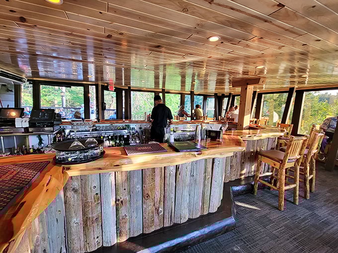 A bar built for stories—where Old Fashioneds are religion and the bartenders are both mixologists and therapists with woodland views.