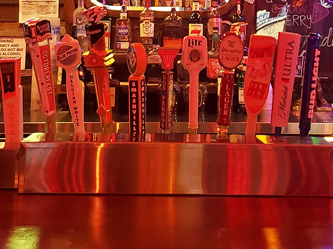 Beer taps standing at attention like soldiers ready to serve—the perfect liquid companions to Champy's legendary fried offerings.