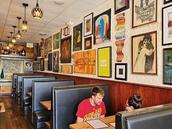 Art-covered walls that give your eyes something to feast on while your mouth is busy. Every booth tells a different story. 