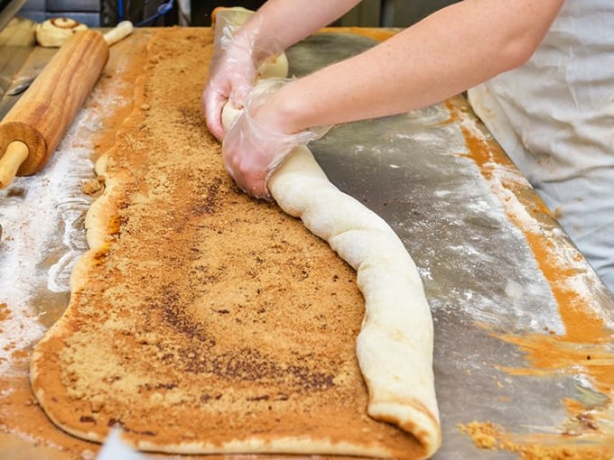 The magic happens here – watching dough transform into cinnamon-sugar dreams. Like witnessing alchemy, but with better results.