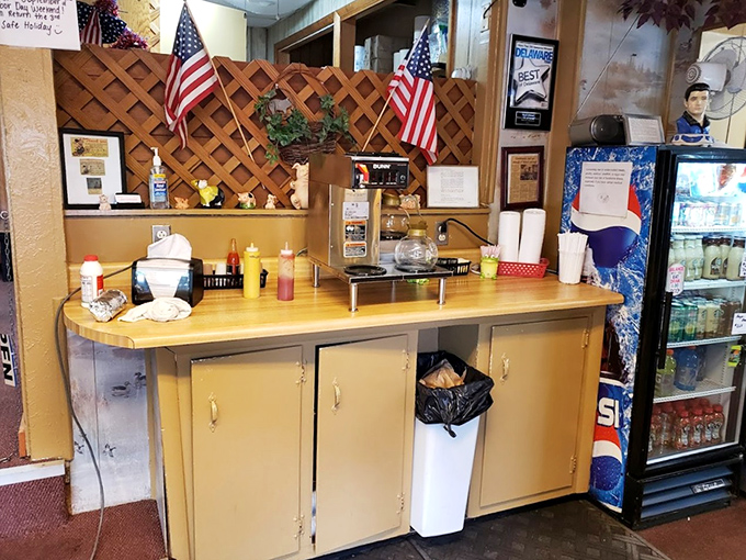 The condiment station—where American flags stand guard over the mustard and ketchup like sentinels of breakfast patriotism.