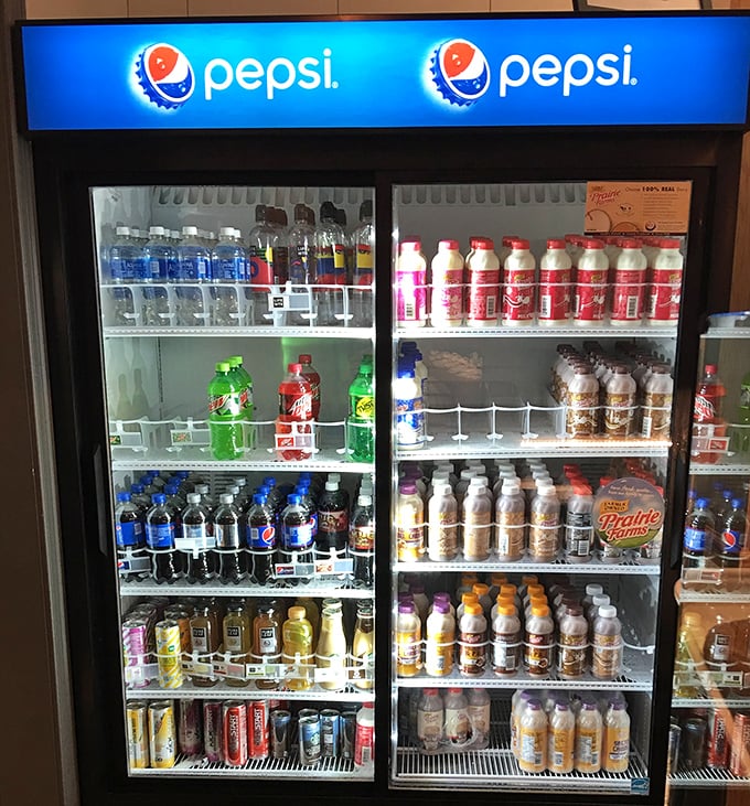Even the beverage case understands its place in the hierarchy—you're here for the donuts, but hydration is still important.