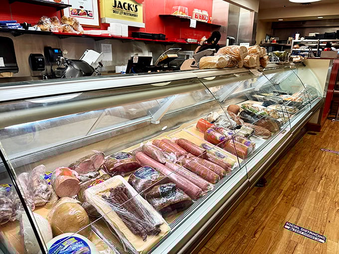 The deli case – a museum of meats where pastrami, corned beef, and salami wait patiently for their moment of sandwich glory.
