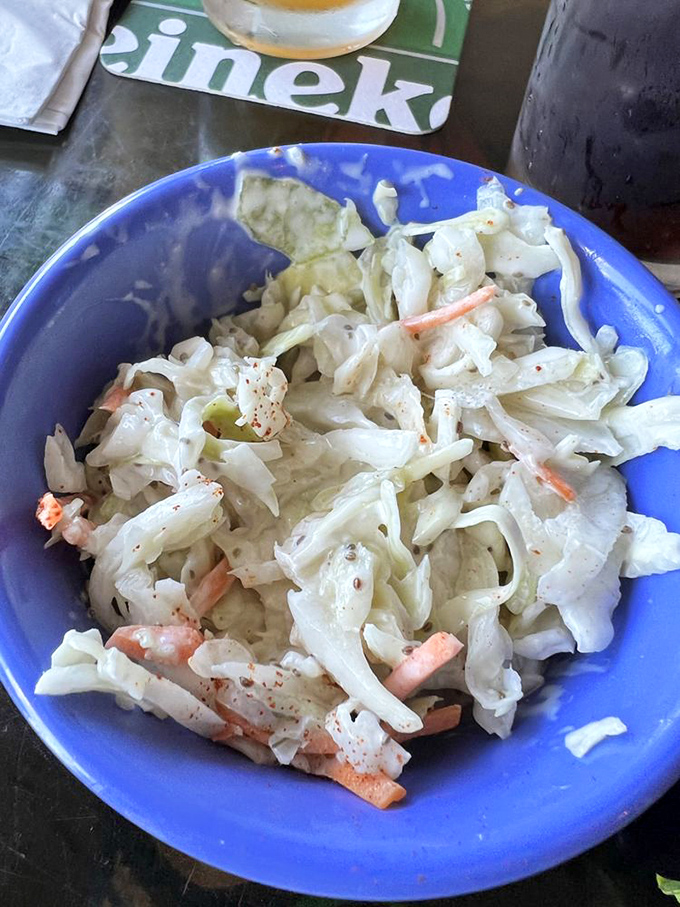 Coleslaw that knows its role—not just a side dish, but a palate-refreshing counterpoint to rich seafood that deserves its own moment in the spotlight.