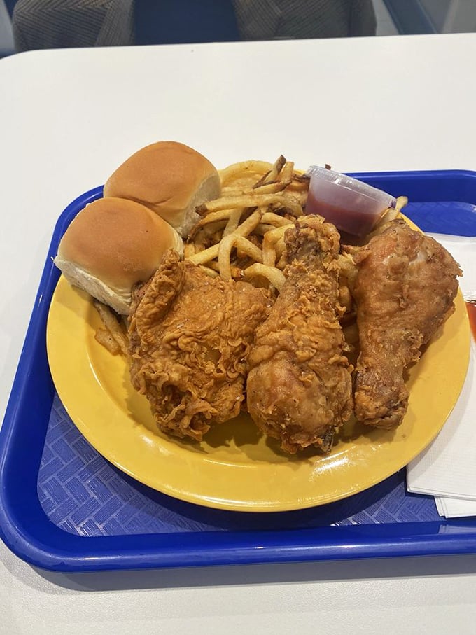 The plate that launched a thousand food comas. Fried chicken, rolls, and fries – a Southern trinity that makes you want to hug the cook.