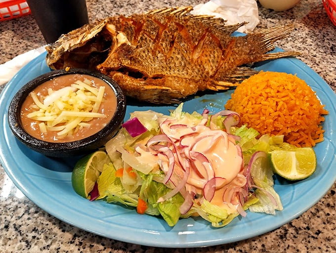 Whole fried fish staring back at you? That's not awkward—that's authentic. The crispy exterior gives way to perfectly flaky meat.