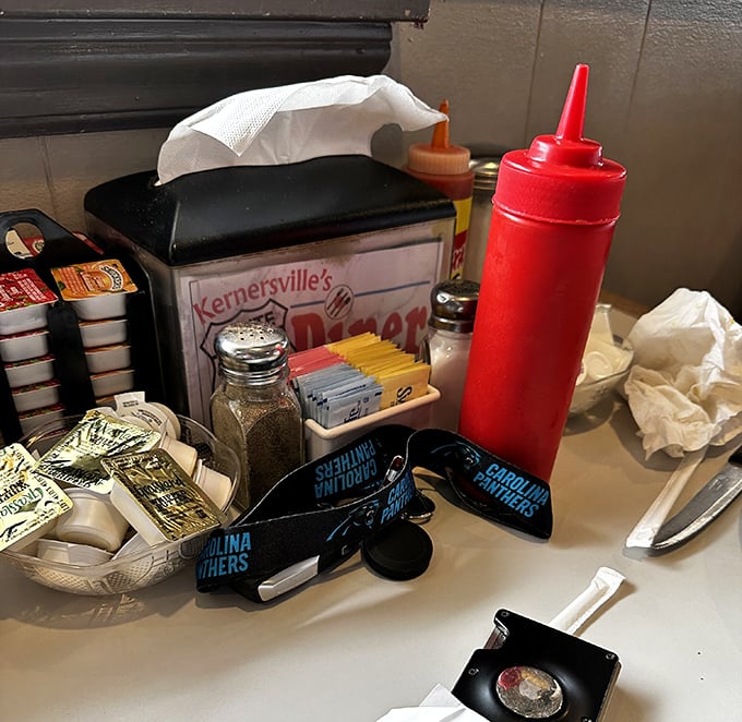 The table essentials – ketchup, mustard, sweeteners, and napkins – humble supporting actors in the grand theater of dining.