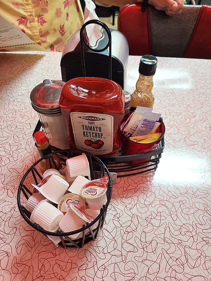 The condiment caddy – that tabletop necessity housing the sweet, savory, and caffeinated essentials for customizing your diner experience to perfection.