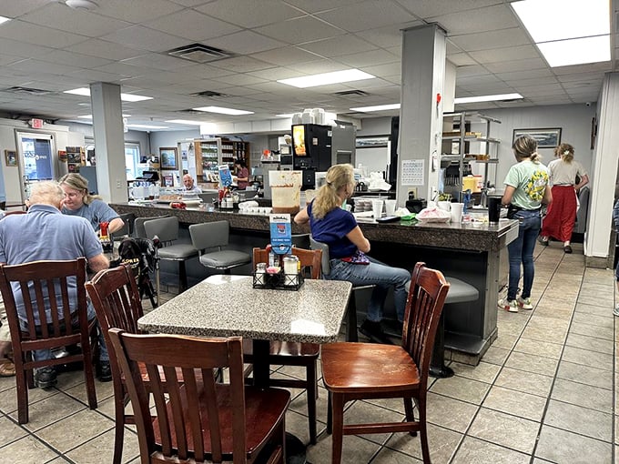 Counter seating offers front-row seats to the theater of eggs, bacon, and coffee choreography.