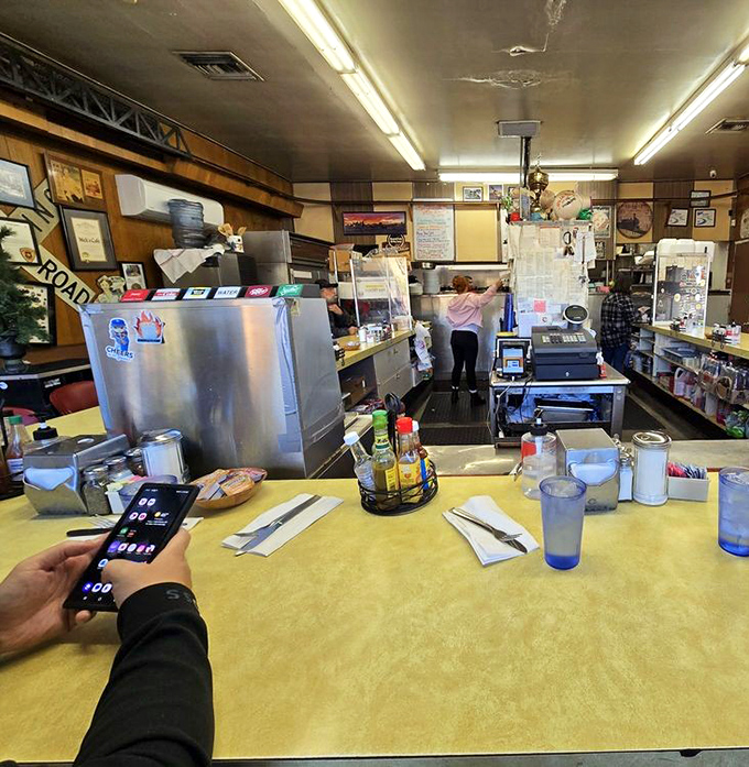 The counter—where strangers become friends over coffee refills and shared appreciation for eggs cooked exactly right. Democracy in action, one breakfast at a time.