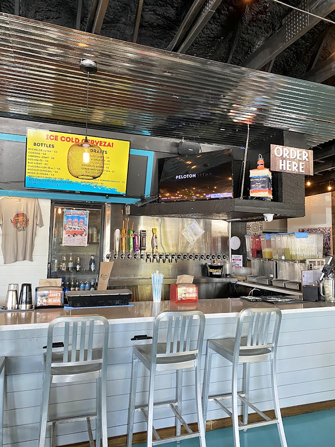 The bar where vacation mode officially begins. Those taps aren't just dispensing beer—they're pouring liquid sunshine to accompany your seafood feast.