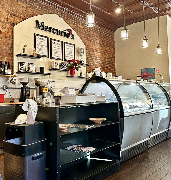Behind this counter, gelato dreams come true. The marble, brick, and warm lighting create the stage where Italian dessert magic happens.