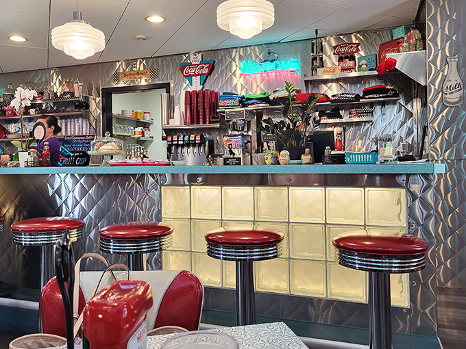 The counter gleams with possibilities and promises. Those red stools have witnessed countless first dates and family celebrations.