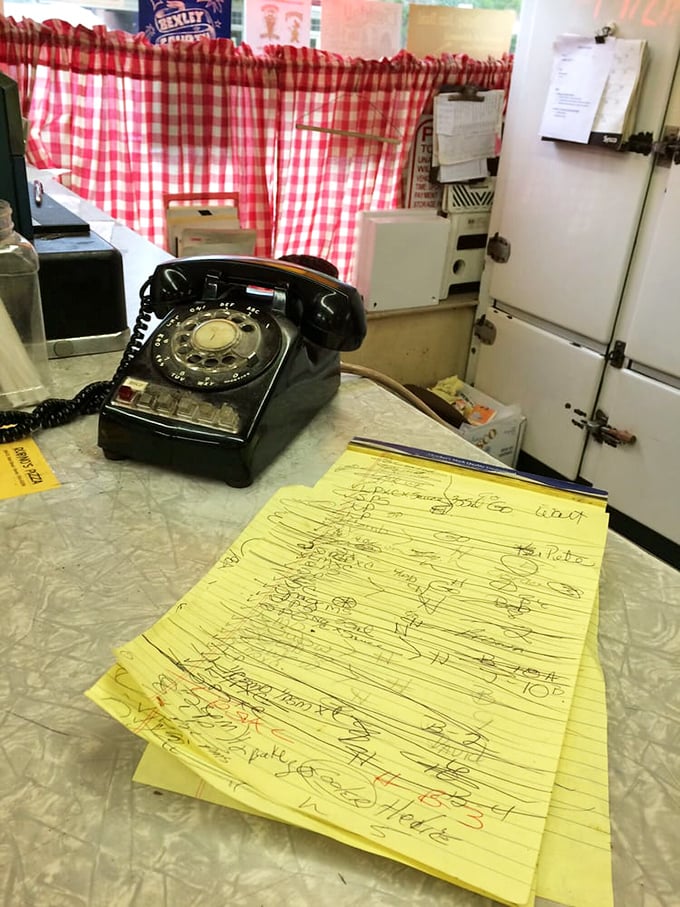 That rotary phone and handwritten order pad aren't retro affectations—they're authentic artifacts from a place where quality trumps trendiness.
