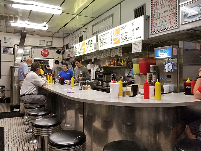 The counter seating isn't just functional—it's theater-in-the-round where diners become part of the Hunter House experience, watching culinary magic unfold.