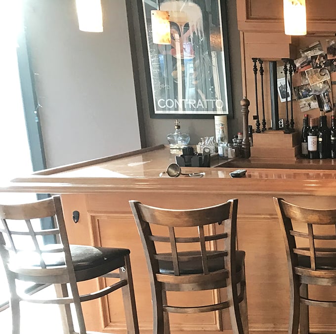 Bar seating: where solo diners become regulars and regulars become family, one martini at a time.