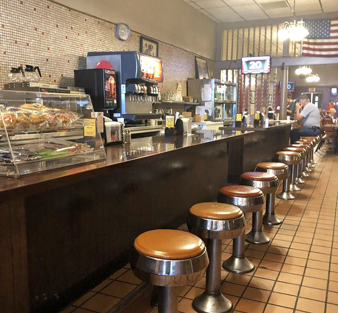 Classic swivel stools lined up like soldiers, ready for the next shift of hungry patrons. Some have supported the same loyal customers for decades.