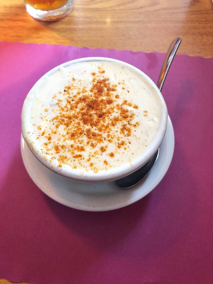 Cream of crab soup that's basically a warm hug in a bowl. That sprinkle of Old Bay on top is the chef's kiss. 