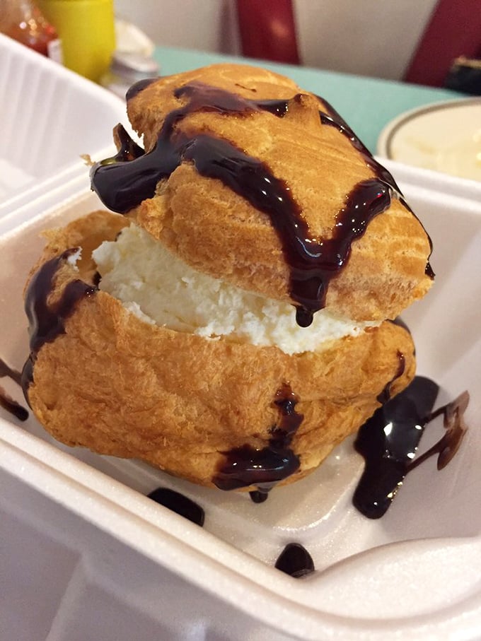 A cream puff drizzled with chocolate that doesn't care about your New Year's resolutions. Some desserts are worth the extra mile on tomorrow's walk.