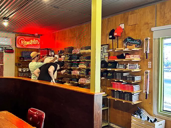 The merchandise corner where barbecue pilgrims transform into walking billboards. Because the only thing better than eating Franklin's is bragging about it afterward.