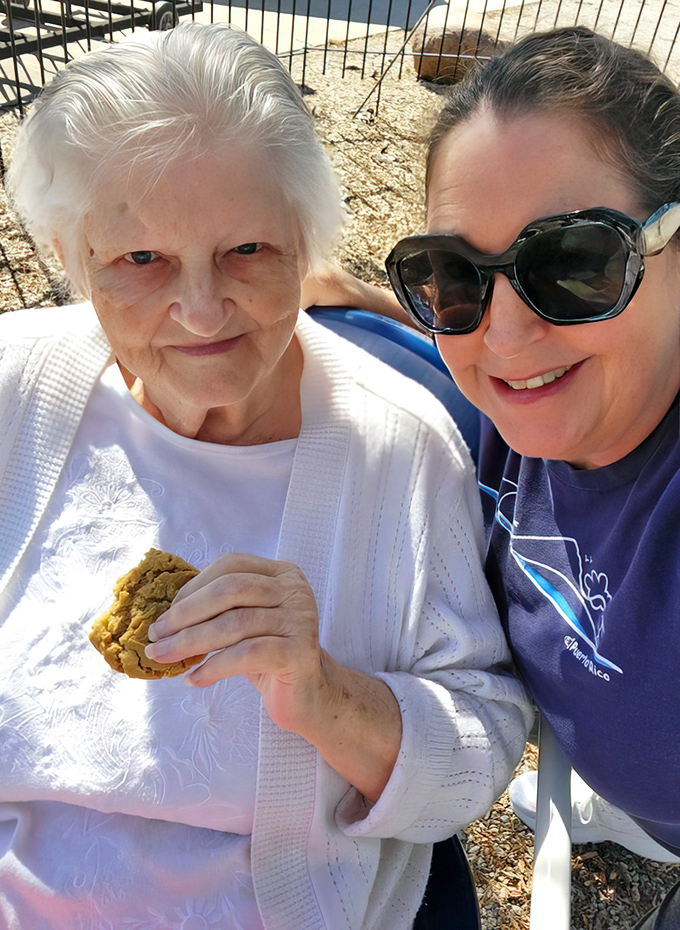 Three generations sharing cookies outside – proof that Miller's Bakery creates memories alongside their incredible baked goods.