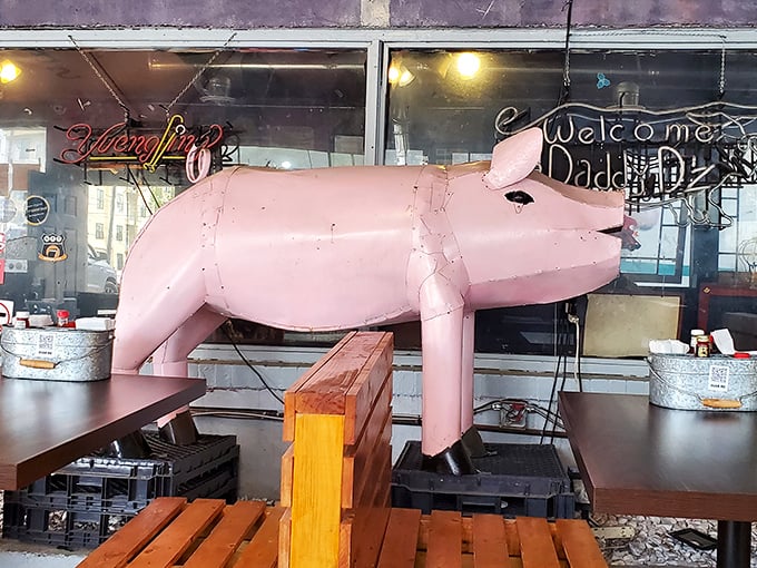 The pink pig isn't just decoration – it's the patron saint of pork, watching over diners with porky benevolence.