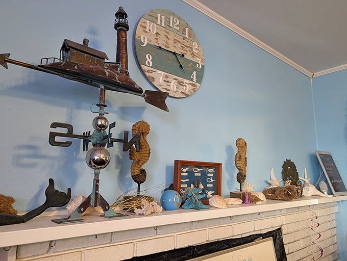 Coastal kitsch done right – weathered seahorses and lighthouse decor that somehow feels authentic rather than touristy. That clock runs on "seafood time."