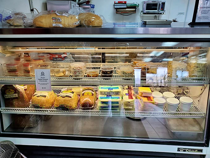 The deli case showcases an impressive array of meats and cheeses that would make any sandwich lover swoon.