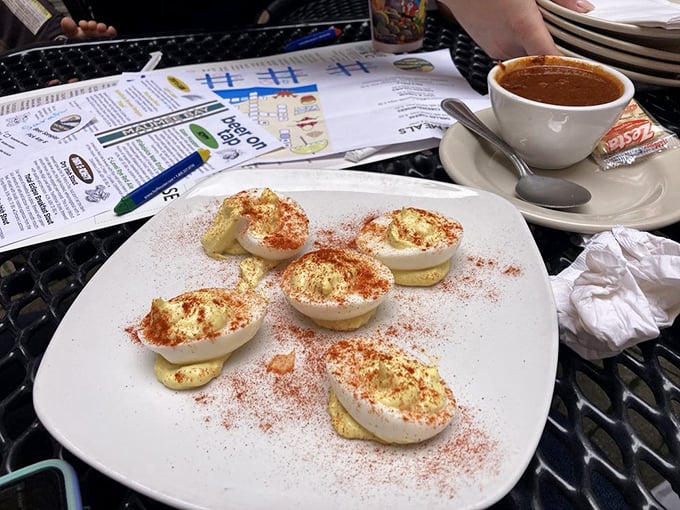 Deviled eggs elevated to art form, dusted with paprika. These aren't your grandmother's potluck staples—unless your grandmother was a culinary genius.