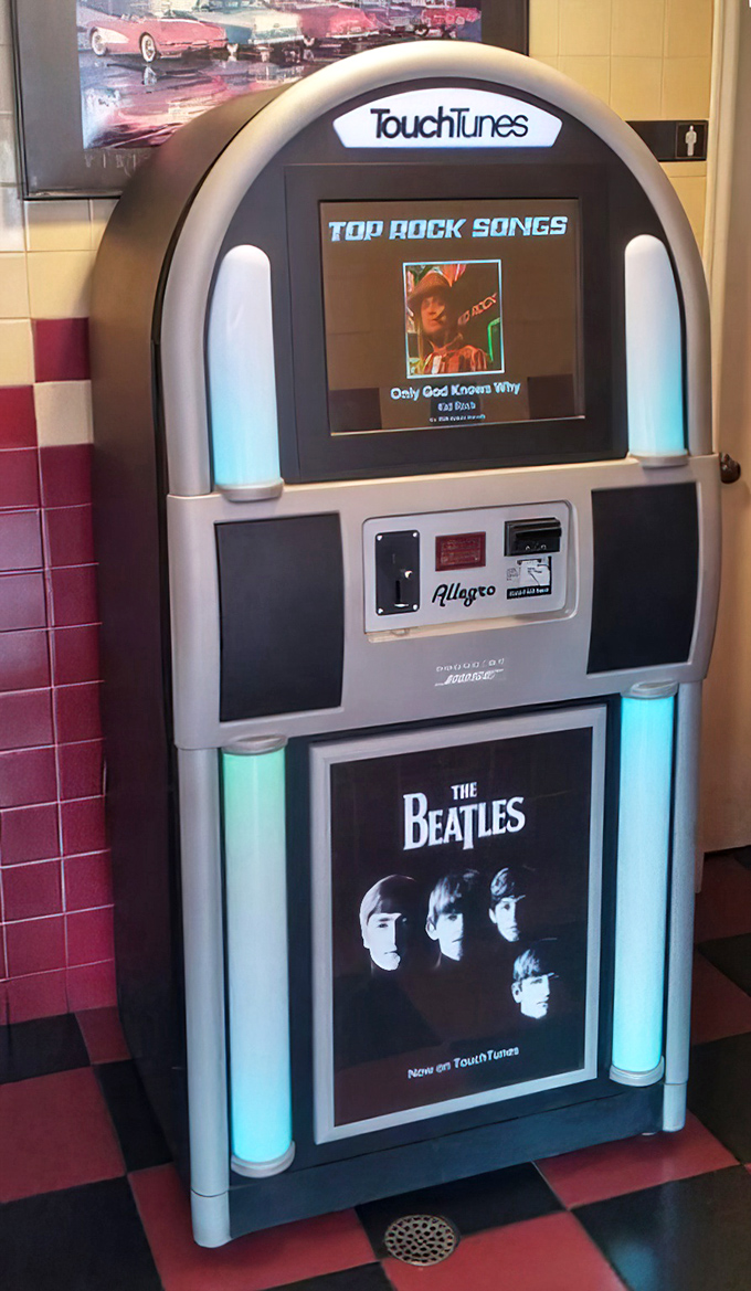 The digital jukebox stands ready to provide the soundtrack to your meal—from The Beatles to Kid Rock, because every feast deserves its own theme music.